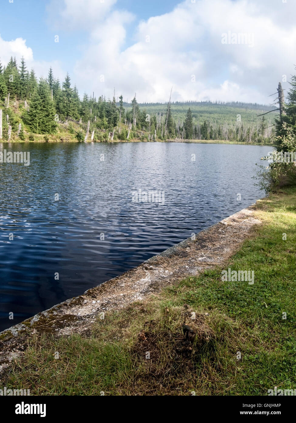 Reschbachklause splash dam with hill on the background and blue sky ...