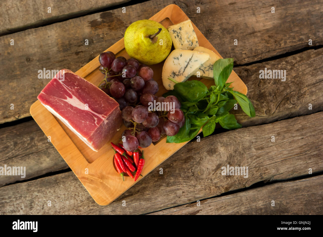 Raw meat on a board Stock Photo - Alamy