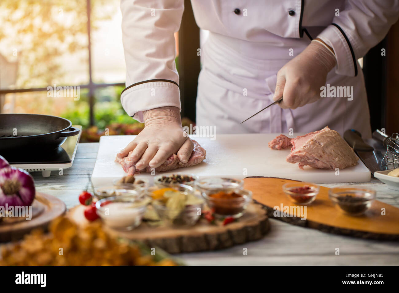 Hand touches raw meat Stock Photo - Alamy