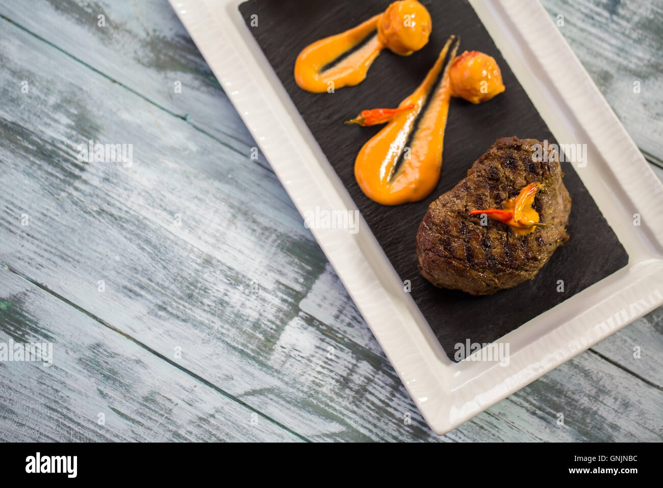 Cooked meat and sauce Stock Photo - Alamy