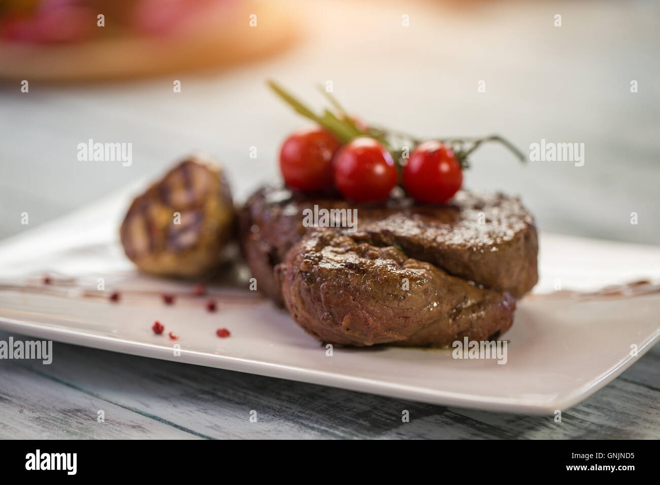 Cooked meat and garlic Stock Photo - Alamy