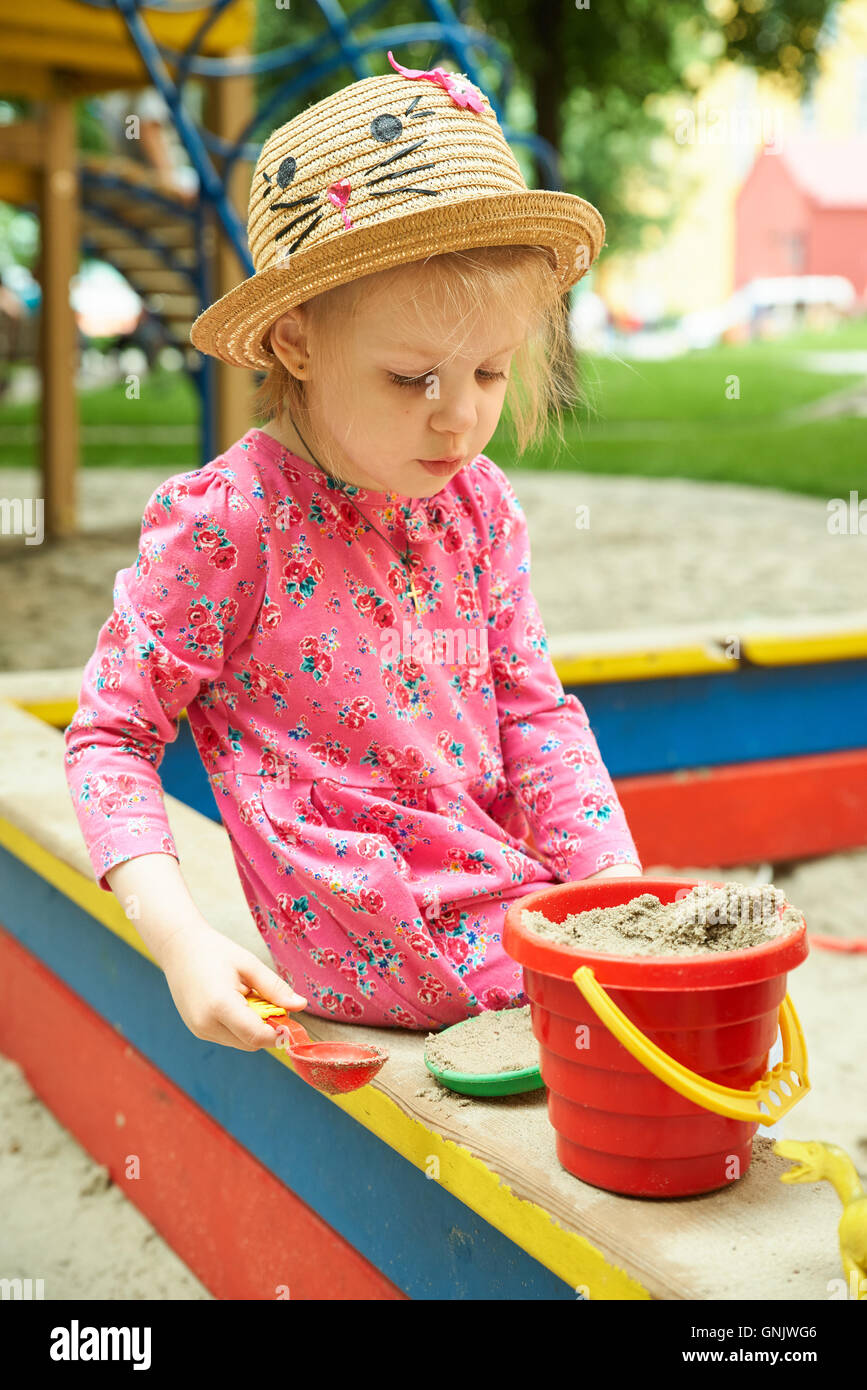 Child on playground in summer park Stock Photo - Alamy