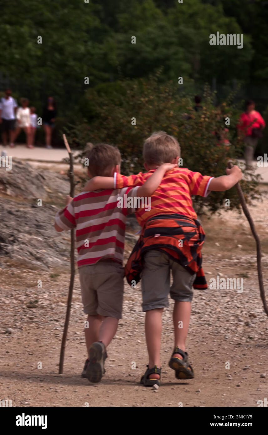 Two boys hugging hi-res stock photography and images - Alamy