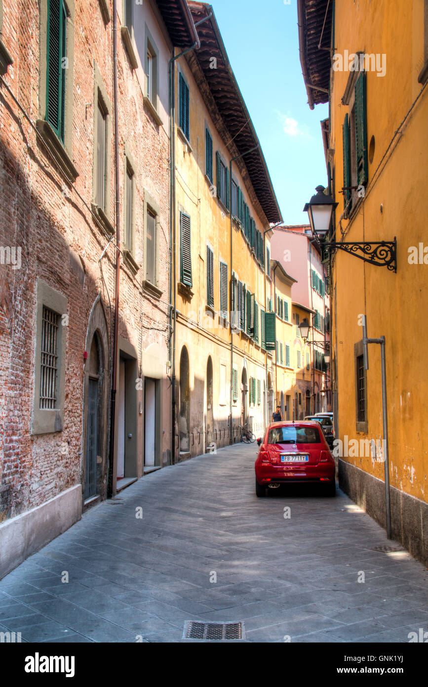 PISA, ITALY - JULY 2016: A typical Italian historical street with a ...