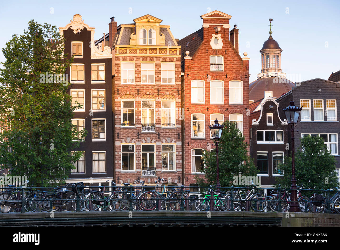 Bicycles and traditional Dutch architecture of canalside buildings in ...