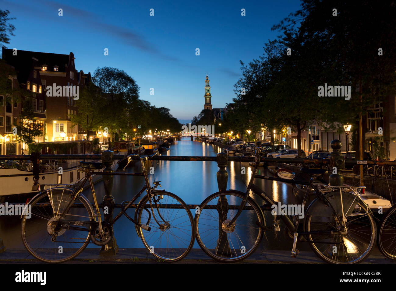 Typical Amsterdam canal scene - Westerkerk church, canal and bicycles ...