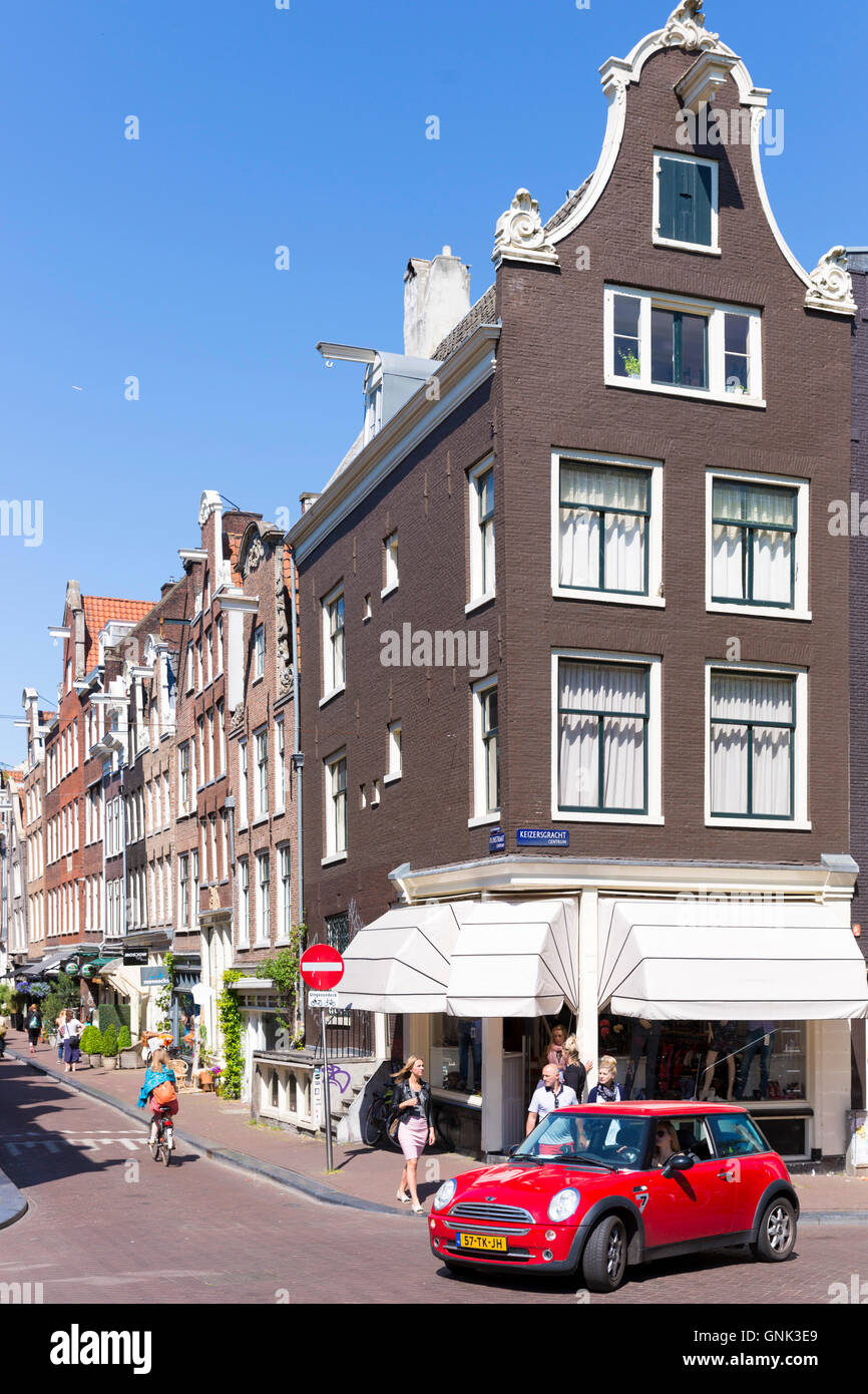 Red mini car along Kaizersgracht in the Nine Streets shopping district ...
