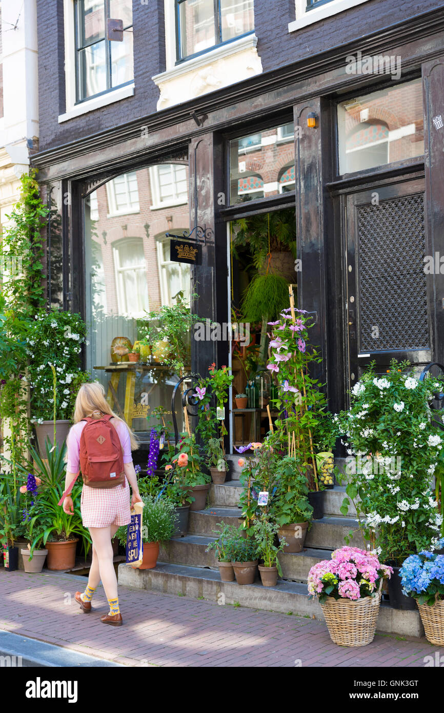 Shopper passes traditional florist shop in the Nine Streets - De Negen ...