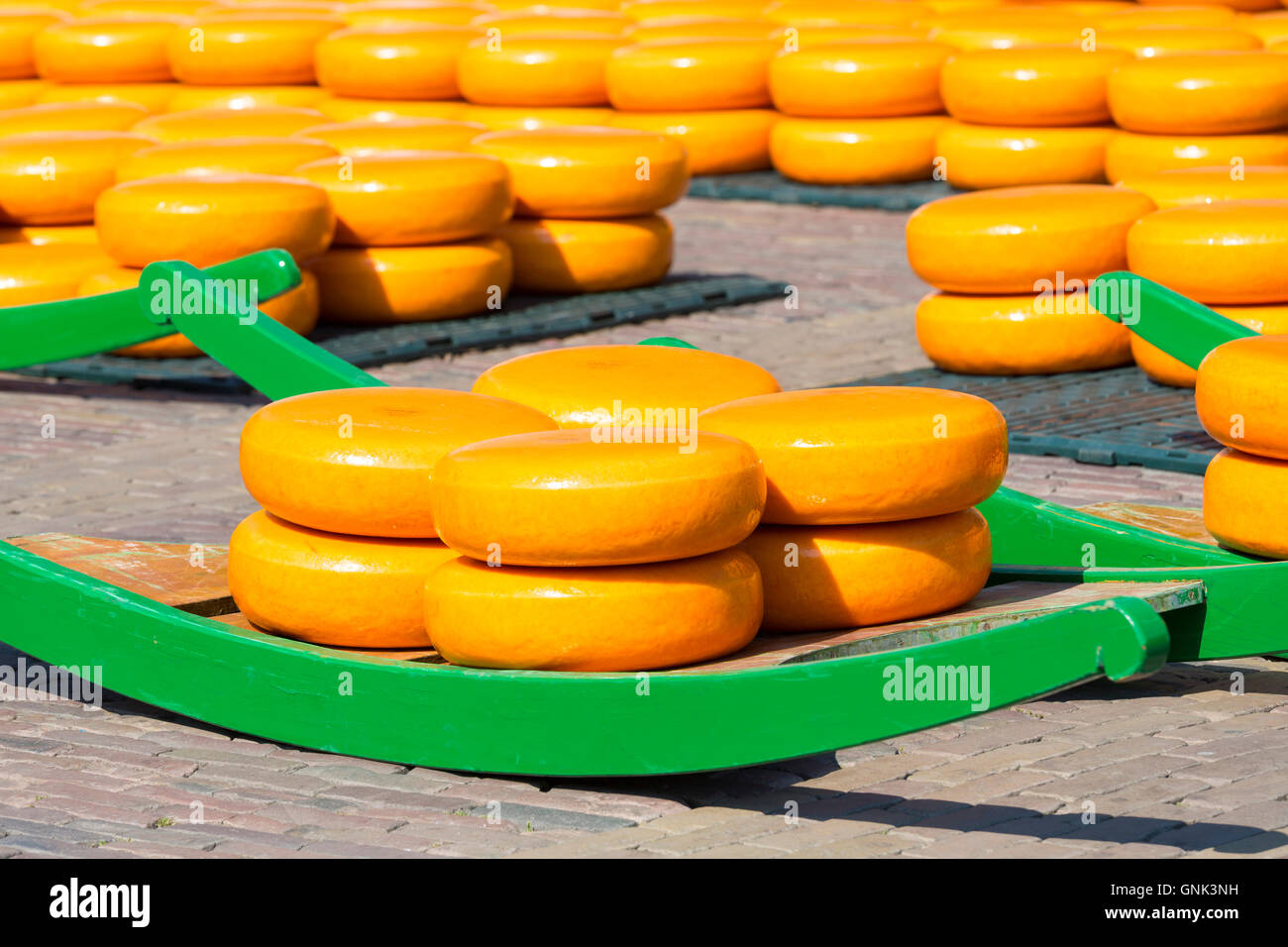 Wheels / rounds of Gouda cheese on sled / stretcher at Waagplein Square ...