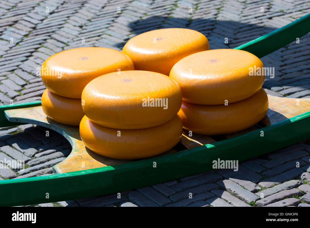 Wheels / rounds of Gouda cheese on sled / stretcher at Waagplein Square ...