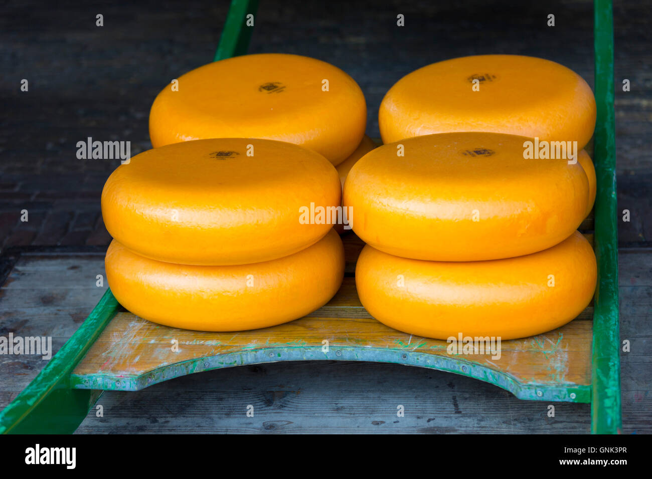Wheels / rounds of Gouda cheese on sled / stretcher at Waagplein Square ...