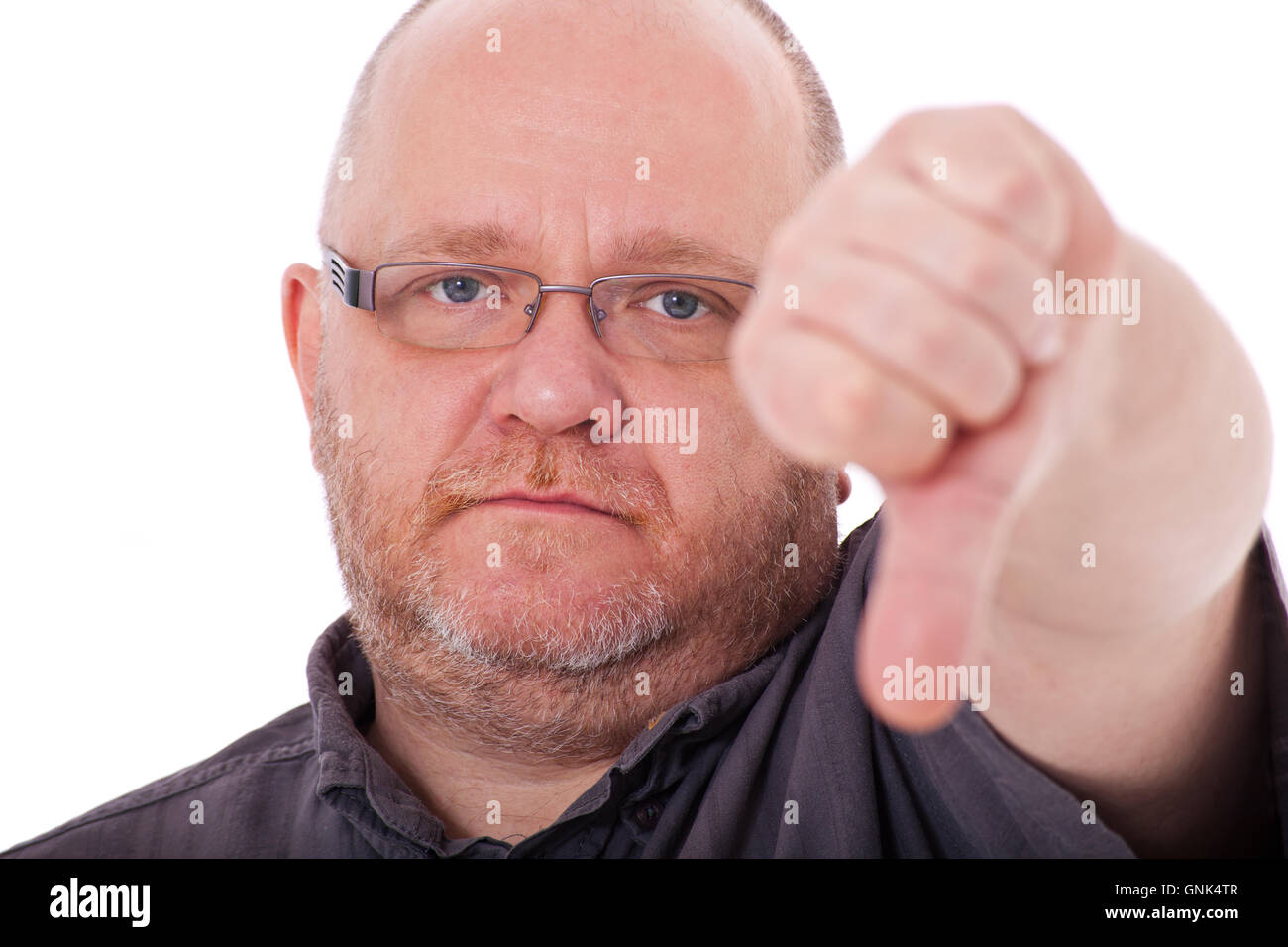 Elderly man showing thumb down Stock Photo - Alamy
