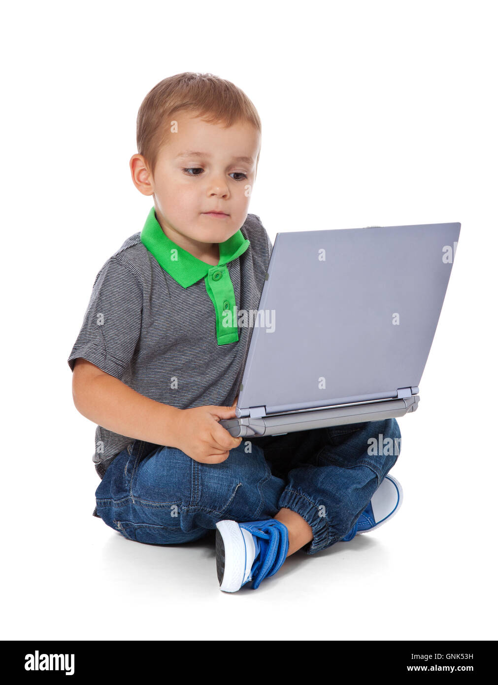 Boy using computer Stock Photo - Alamy