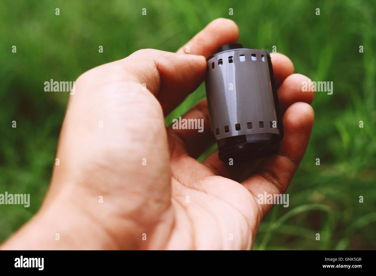 Negative film on hand Stock Photo - Alamy