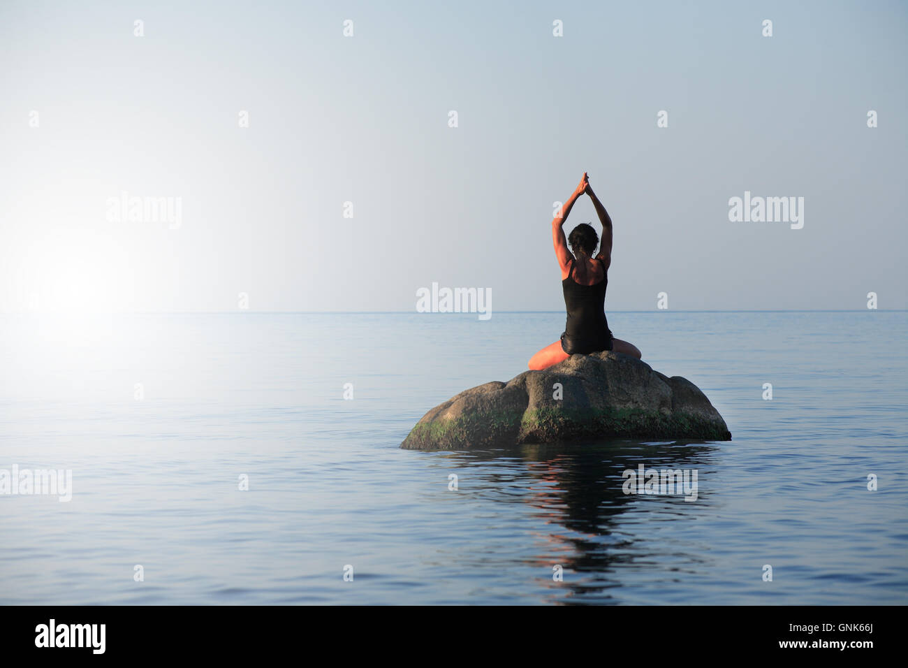 Yoga In The Sea Stock Photo - Alamy