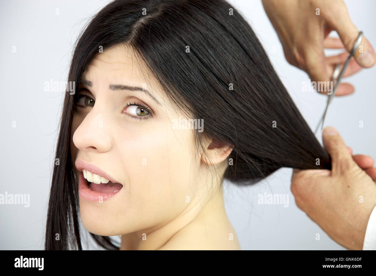 Beautiful woman screaming while her long hair are cut Stock Photo - Alamy