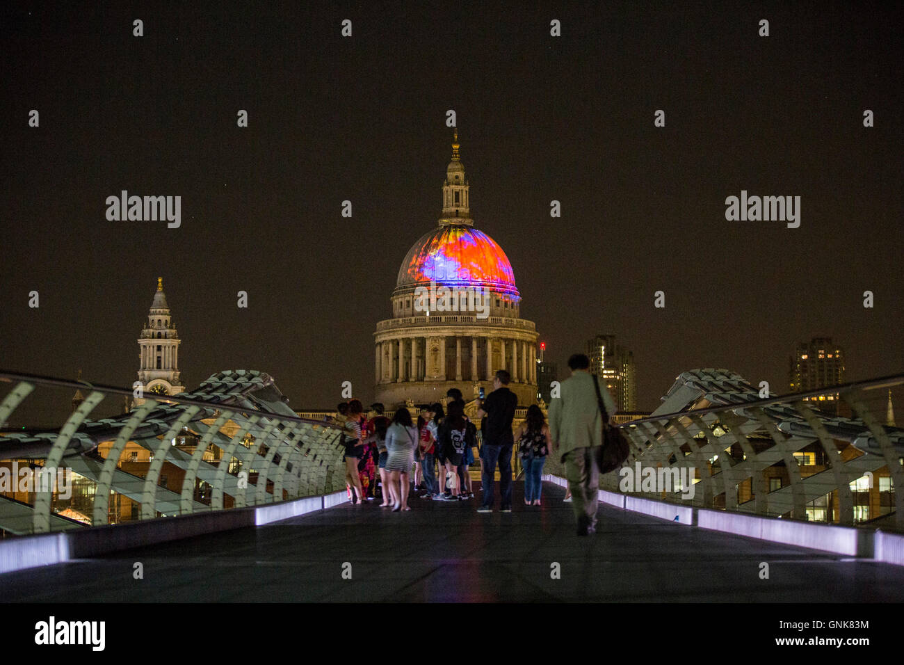 The dome of St Paul's Cathedral in London is lit up with a fiery ...