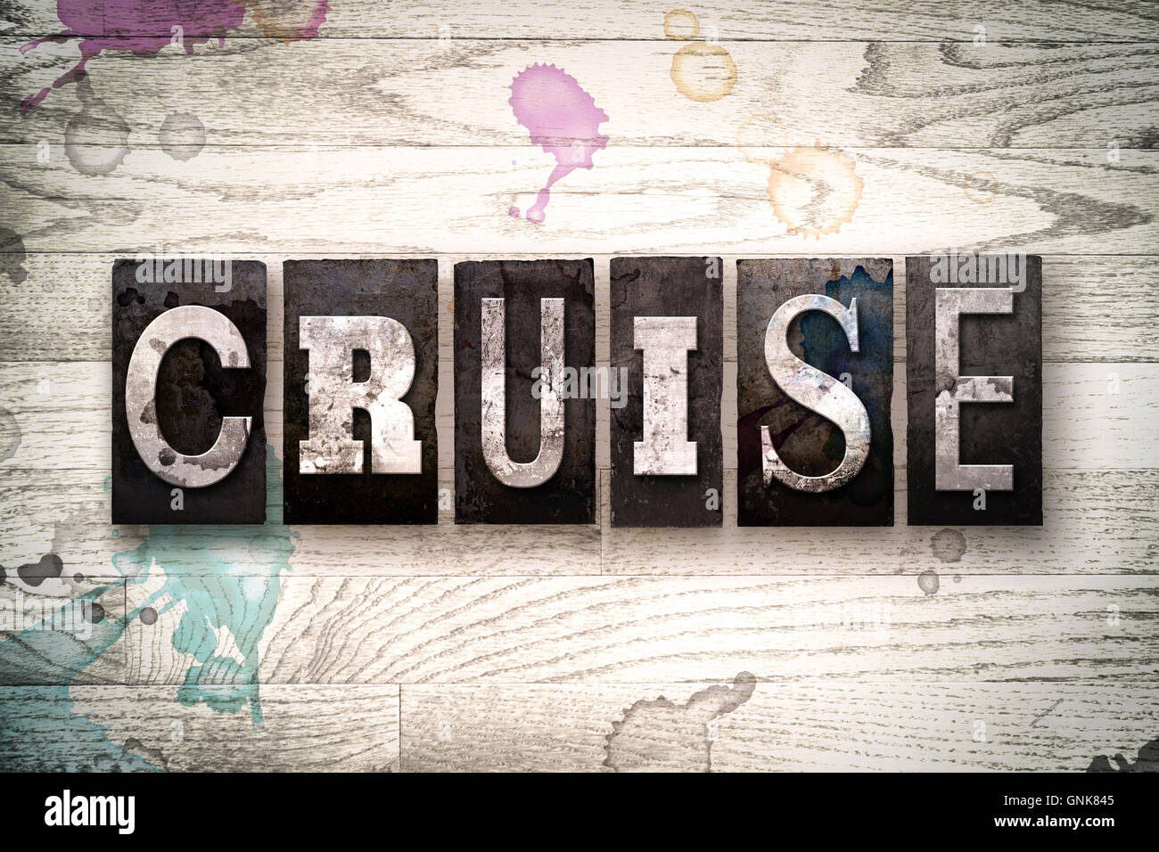 The word "CRUISE" written in vintage, dirty metal letterpress type on a ...