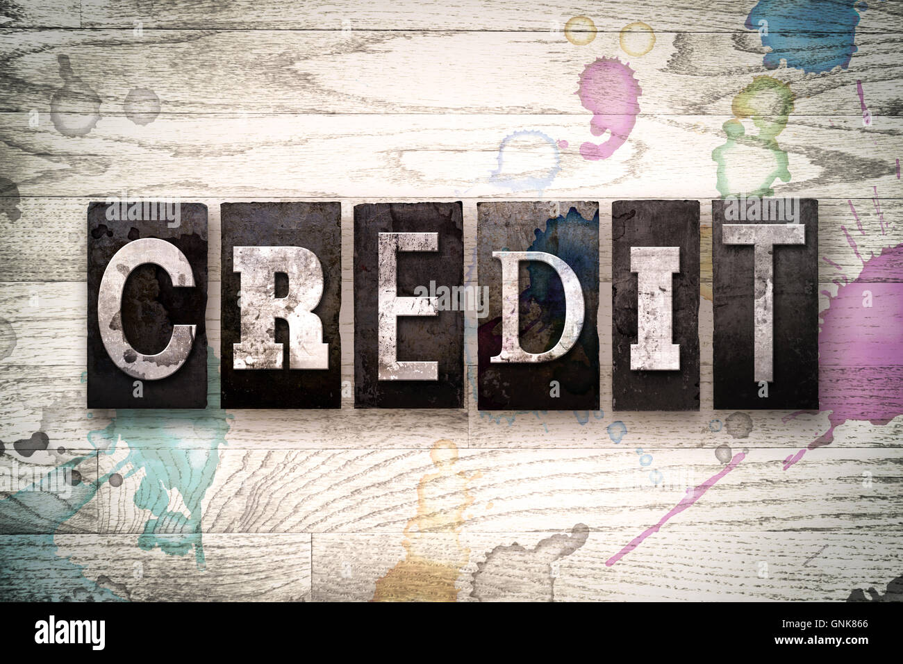 The word "CREDIT" written in vintage, dirty metal letterpress type on a ...