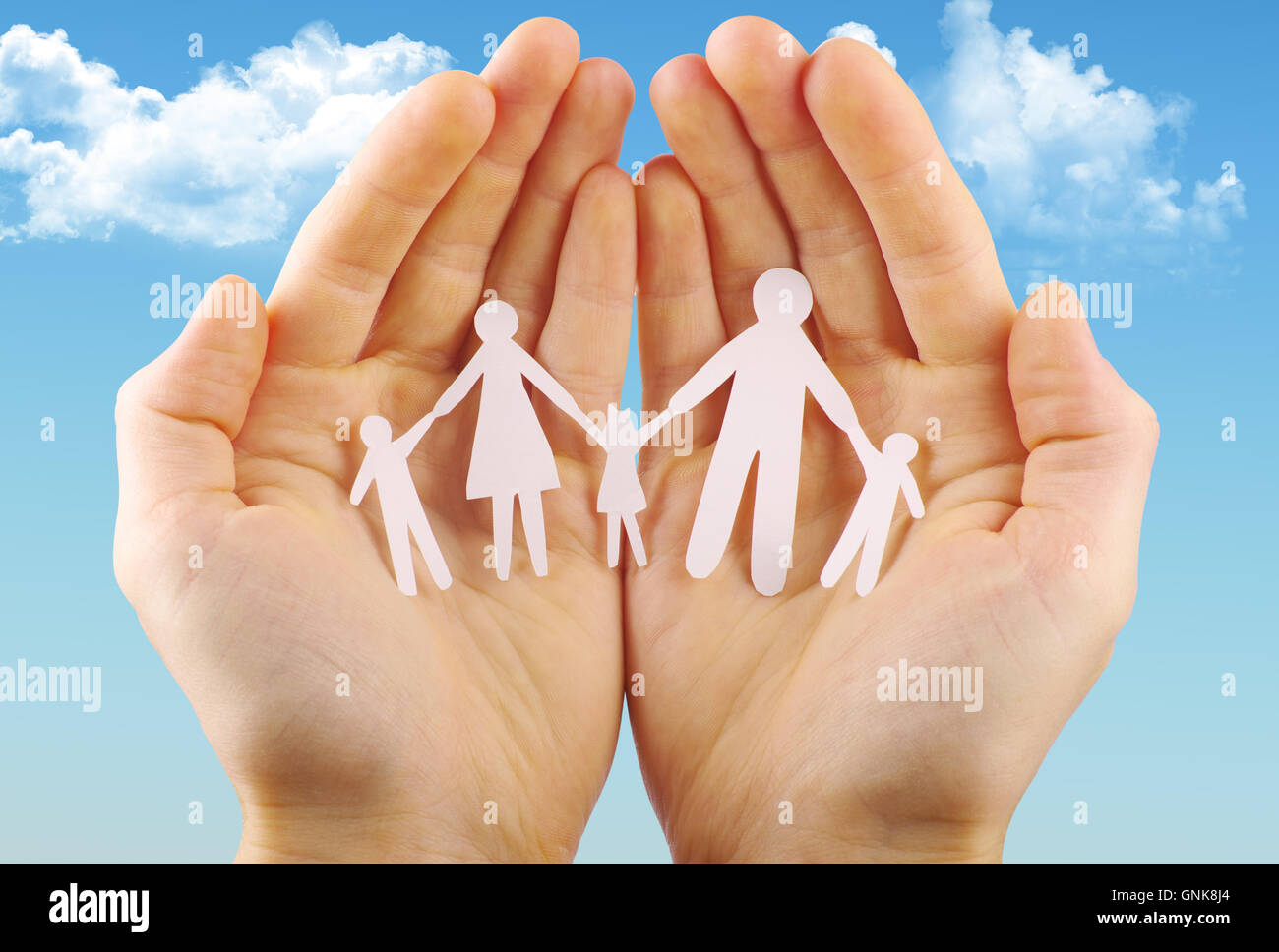Paper family in hands Stock Photo - Alamy