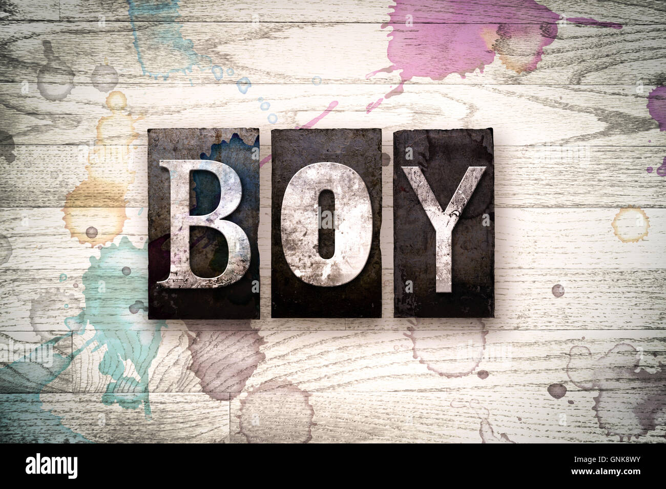 The word "BOY" written in vintage, dirty metal letterpress type on a ...