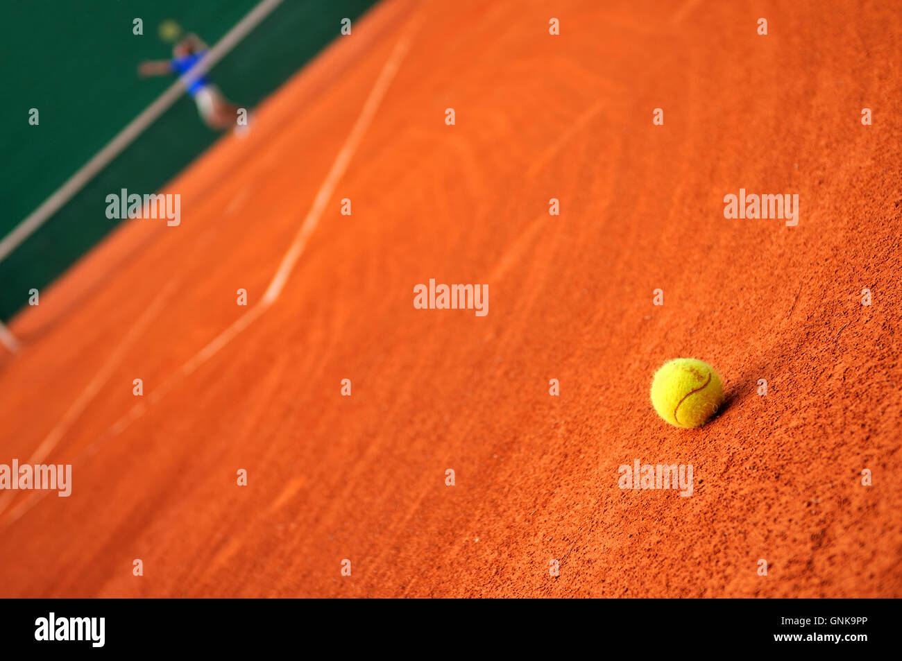 One tennis ball on court Stock Photo - Alamy