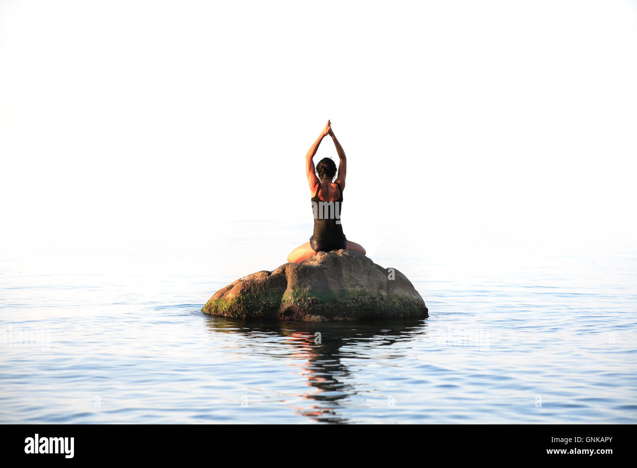 Yoga In The Sea Stock Photo - Alamy