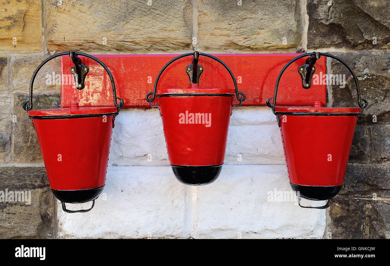 Fire buckets adorn a station platform Stock Photo - Alamy