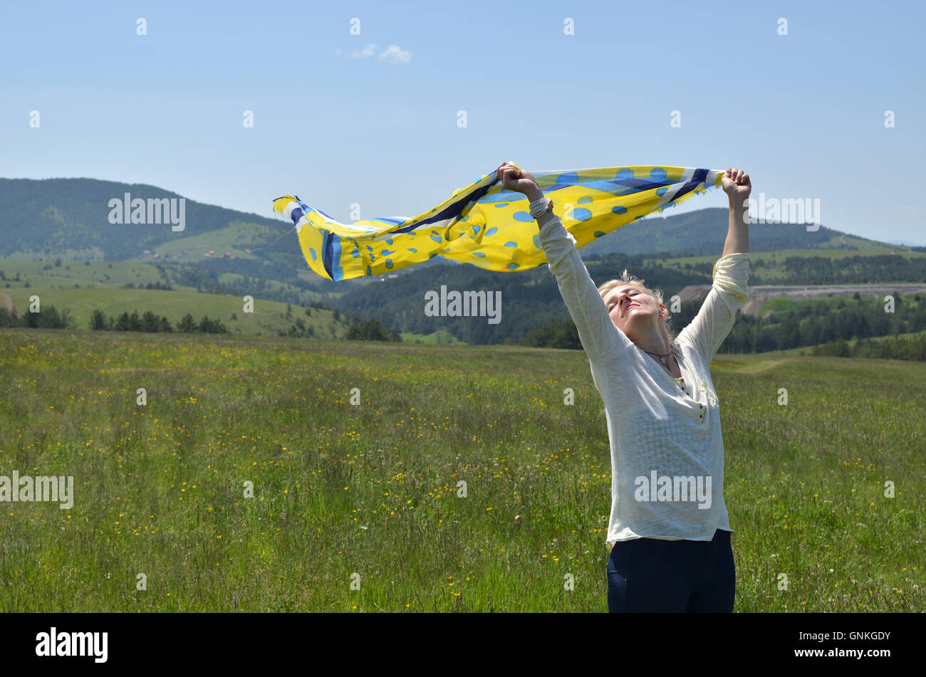 Woman with scarf blowing in the wind hi-res stock photography and ...
