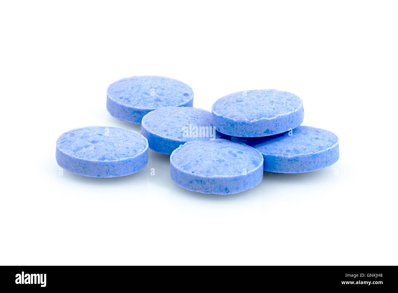 Blue pills close up circle shape macro photography drug on white ...