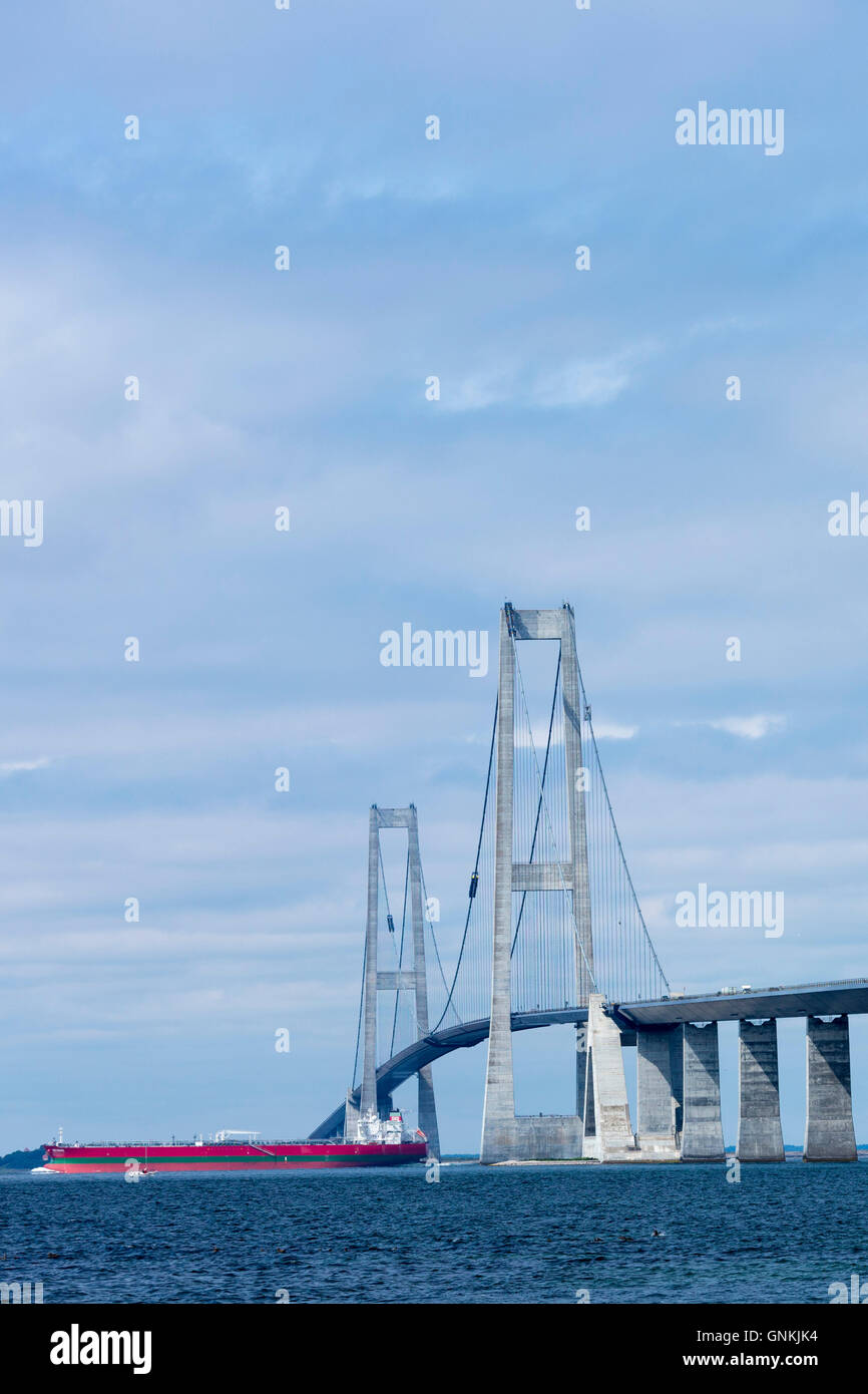 Oil tanker passes under The Great Belt Bridge suspension bridge over ...