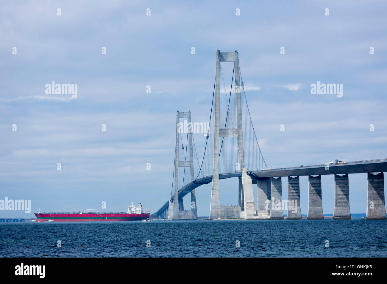 Oil tanker passes under The Great Belt Bridge suspension bridge over ...