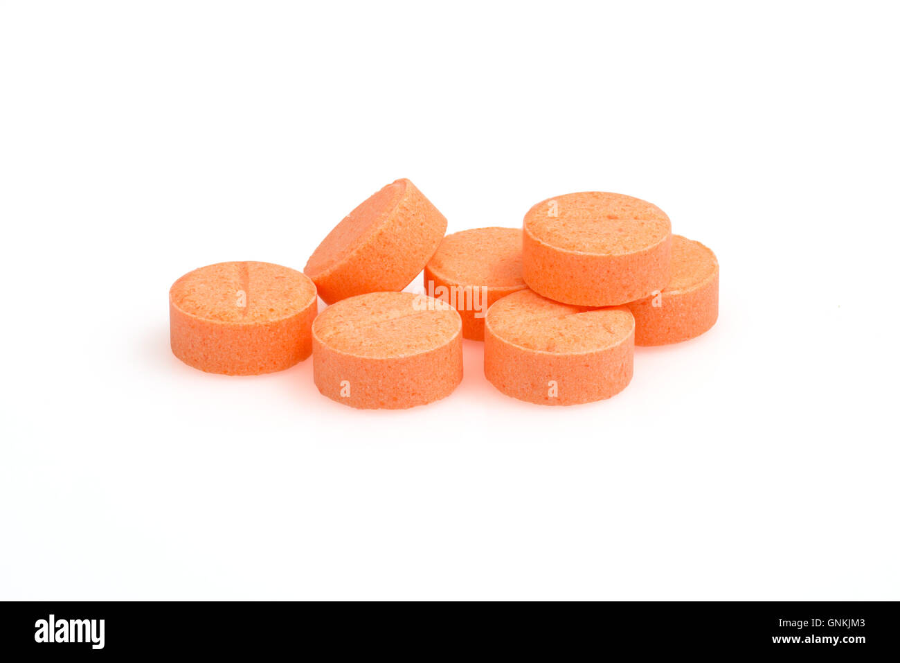 Orange color pills close up macro photography drug on white background ...