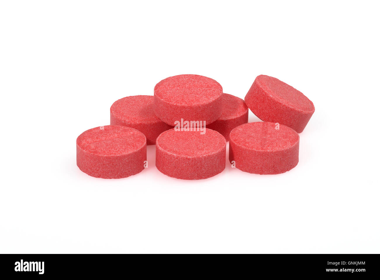 Red color pills close up macro photography drug on white background ...