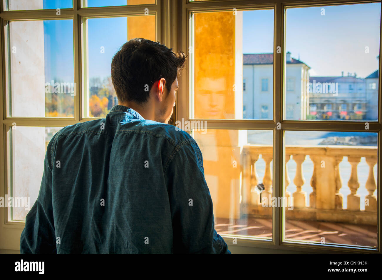 Old man looks out the window hi-res stock photography and images - Alamy