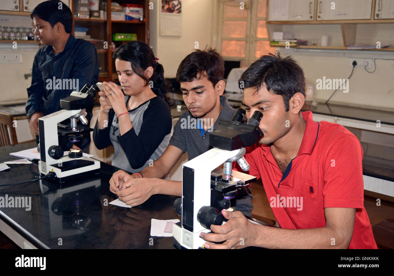 Student working in classroom Stock Photo - Alamy