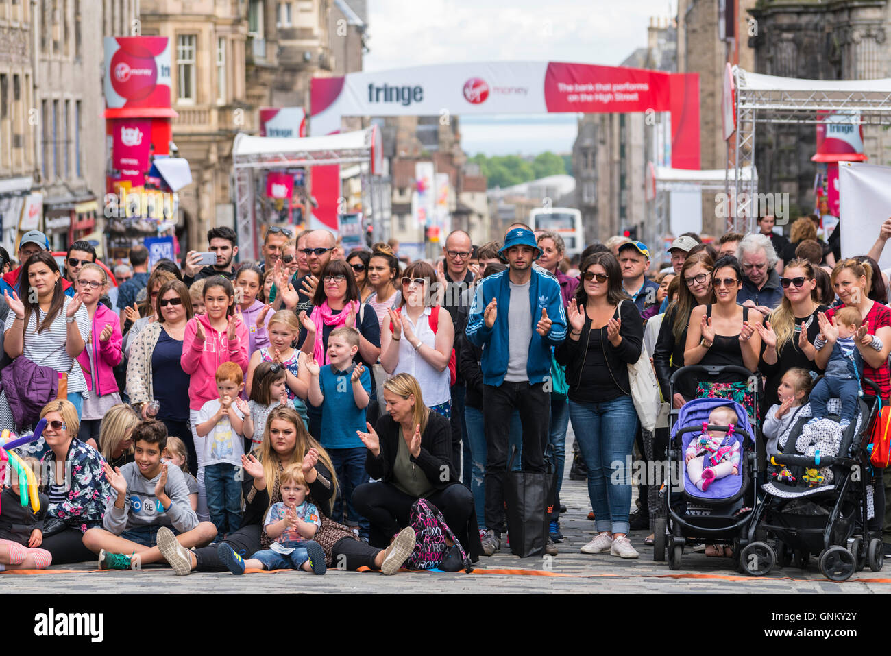 Large crowd watch street performance on High Street during Edinburgh ...
