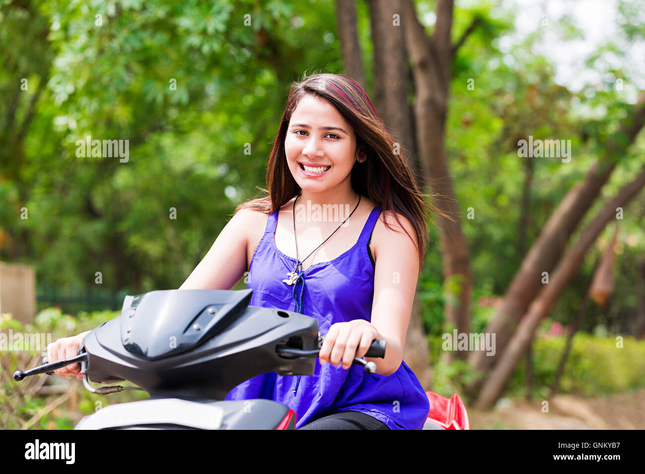 1 Young Girl Park Riding Scooty Stock Photo - Alamy