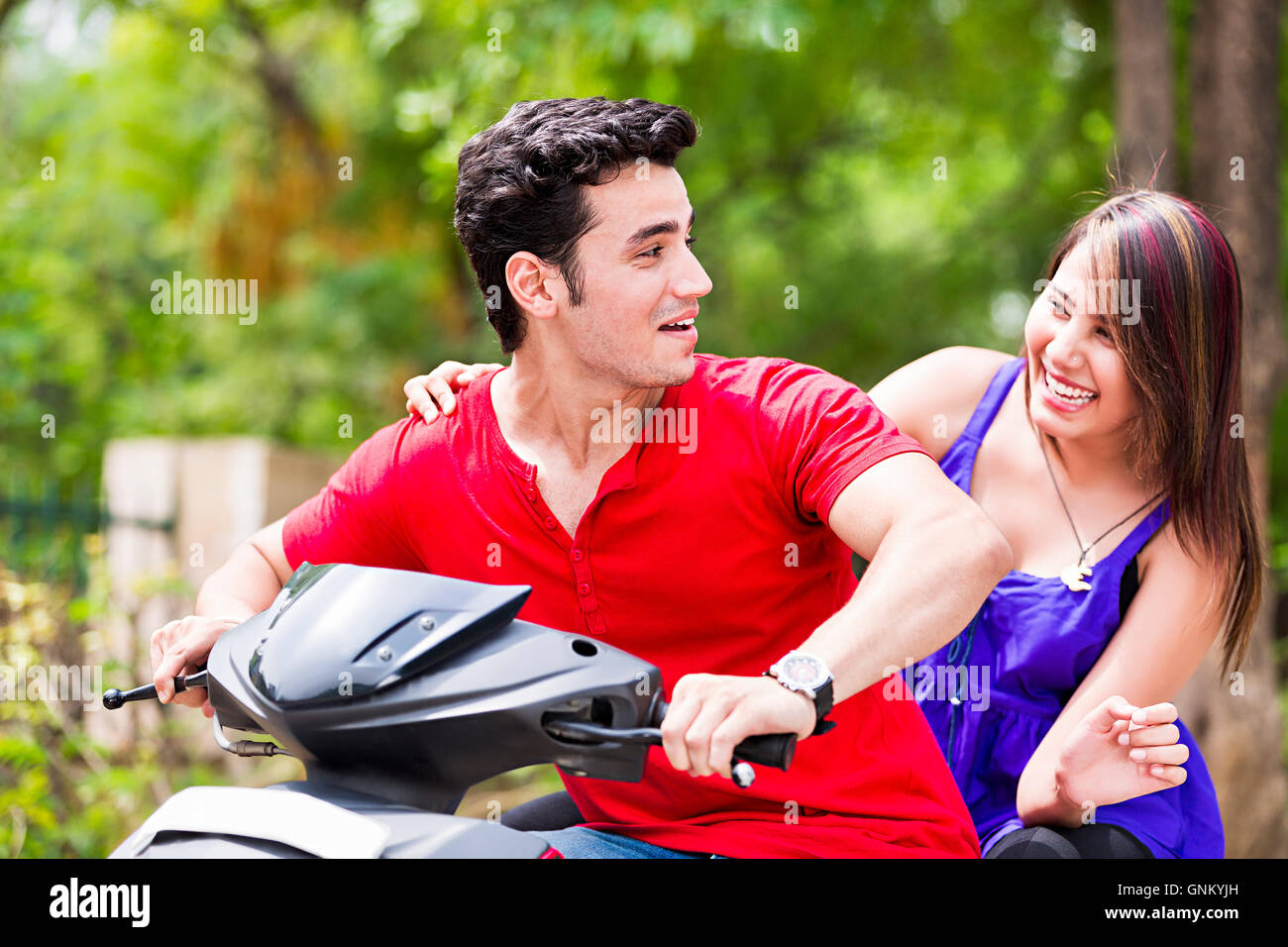 Boy girl scooter hi-res stock photography and images - Alamy