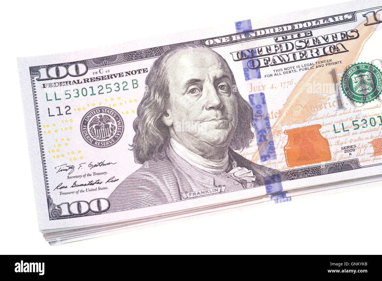 Stacked dollar banknotes over white Stock Photo - Alamy