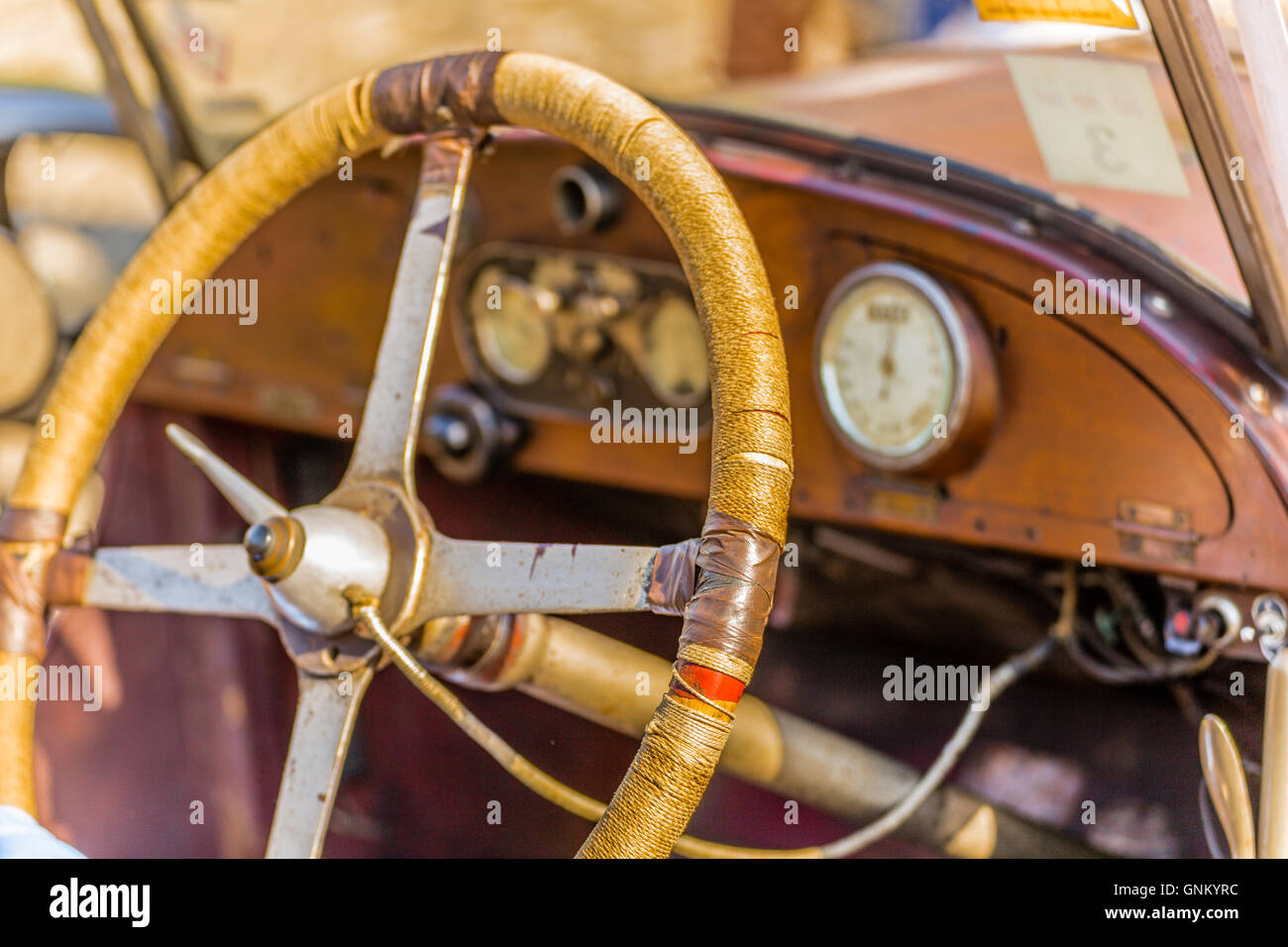steering wheel and dashboard of a vintage car from the early twentieth ...