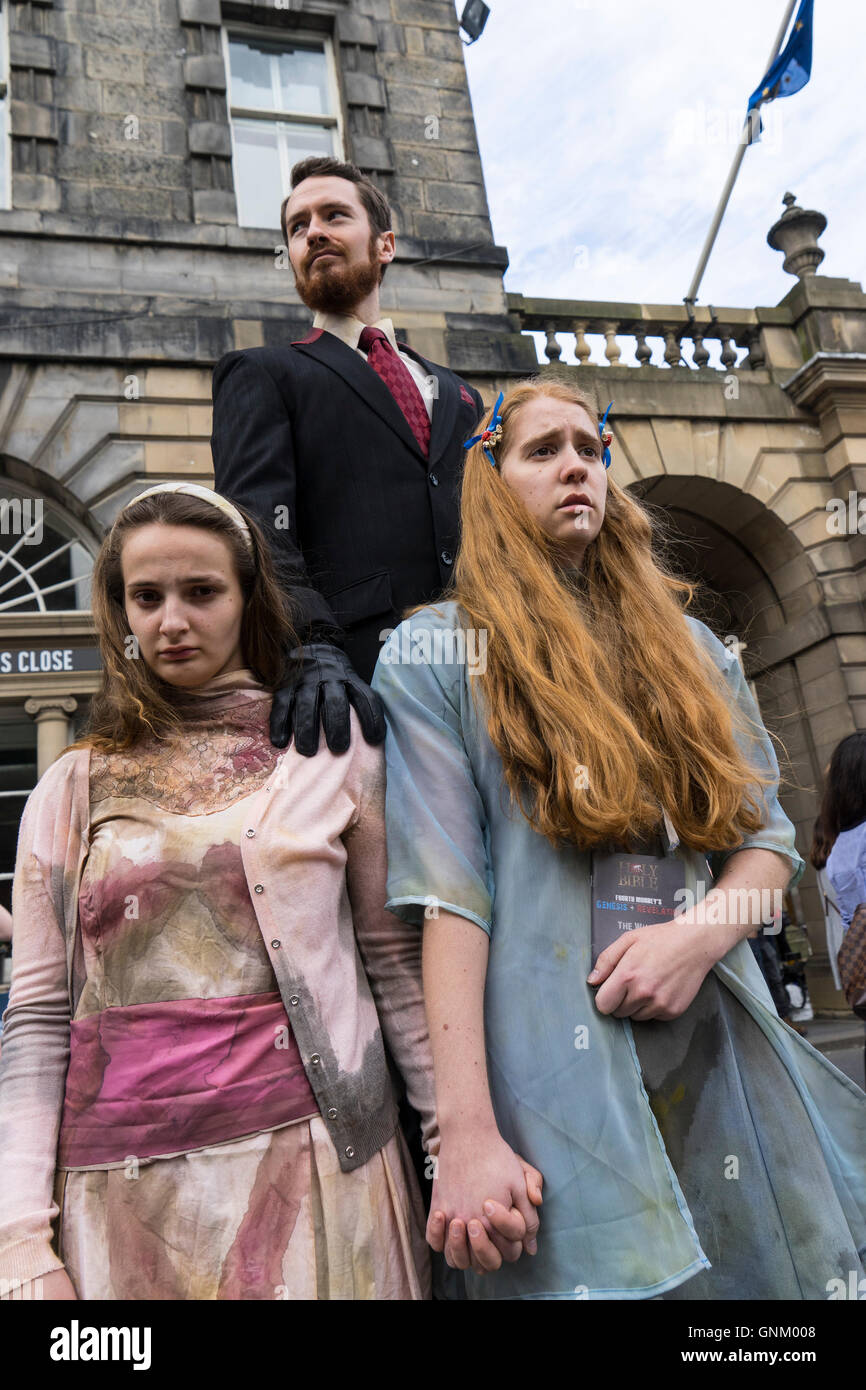Actors promoting their theatre production on High Street during ...