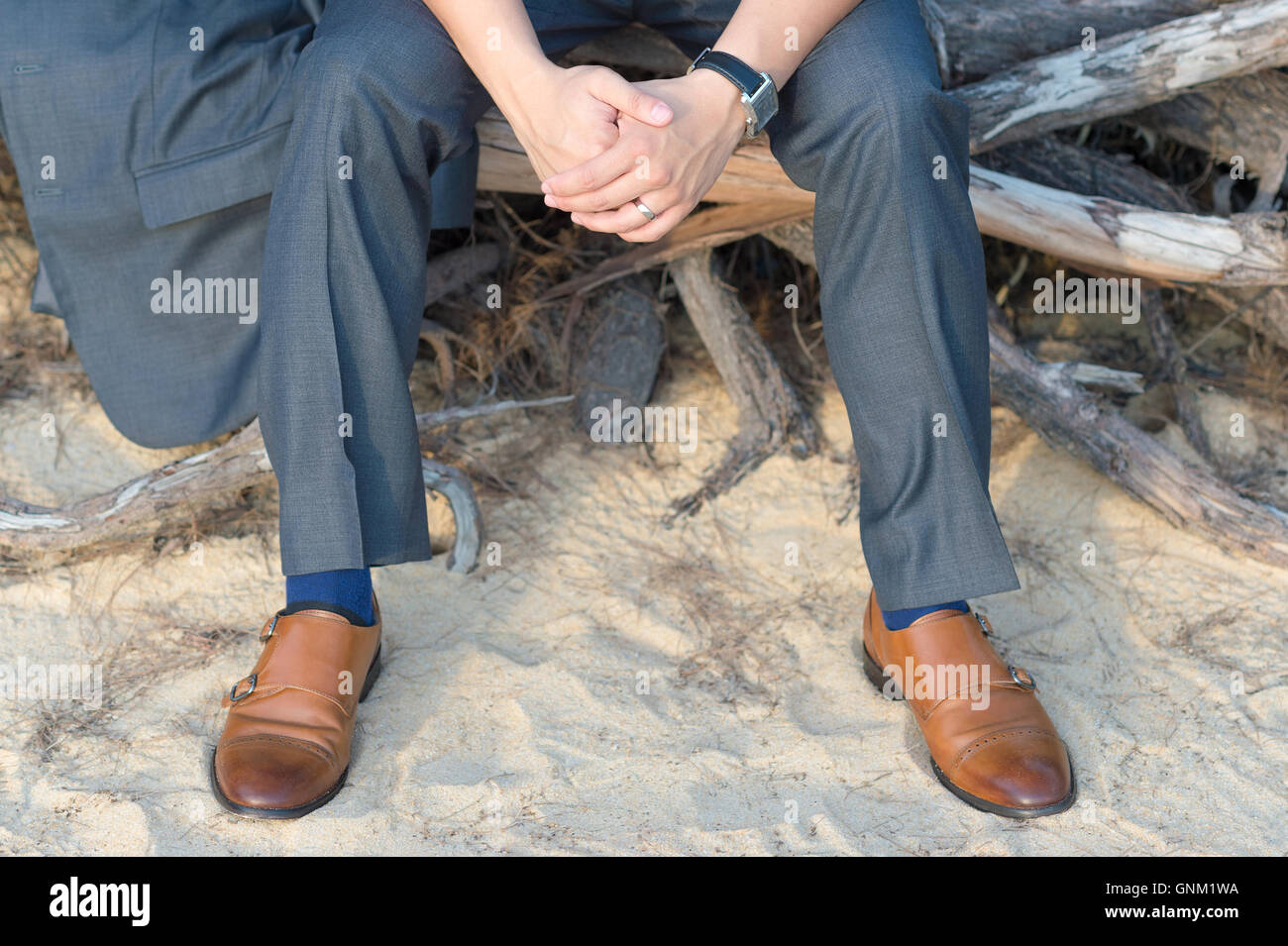 Man sitting on roots hi-res stock photography and images - Alamy