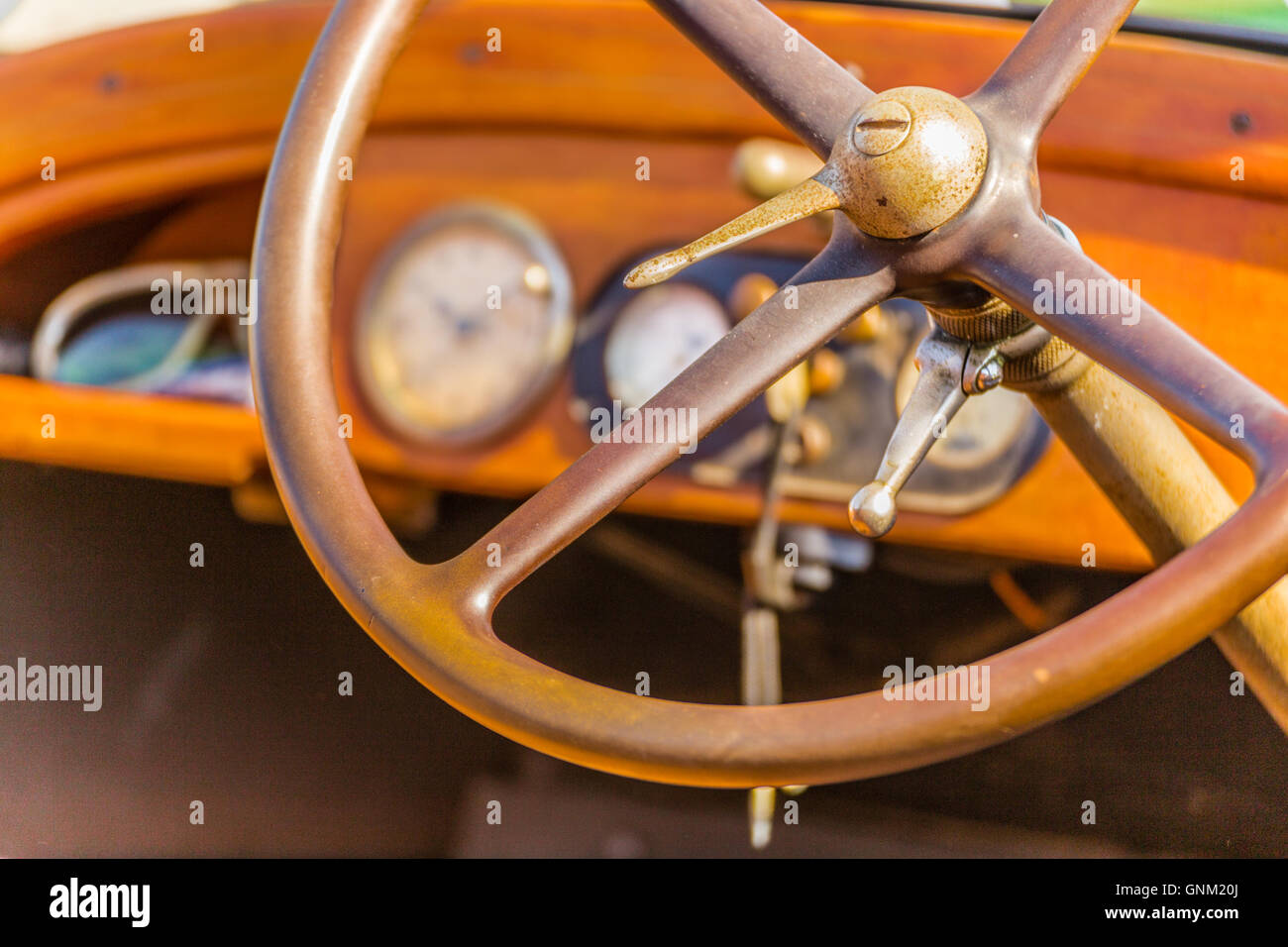 steering wheel and dashboard of a vintage car from the early twentieth ...