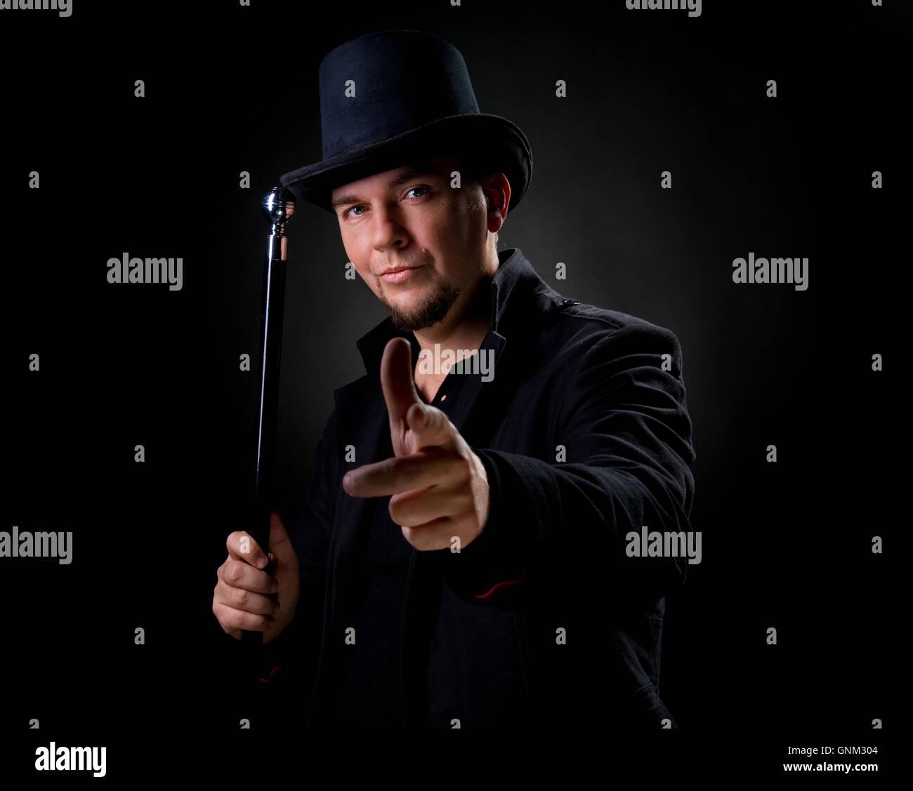 Man pointing with stick hi-res stock photography and images - Alamy