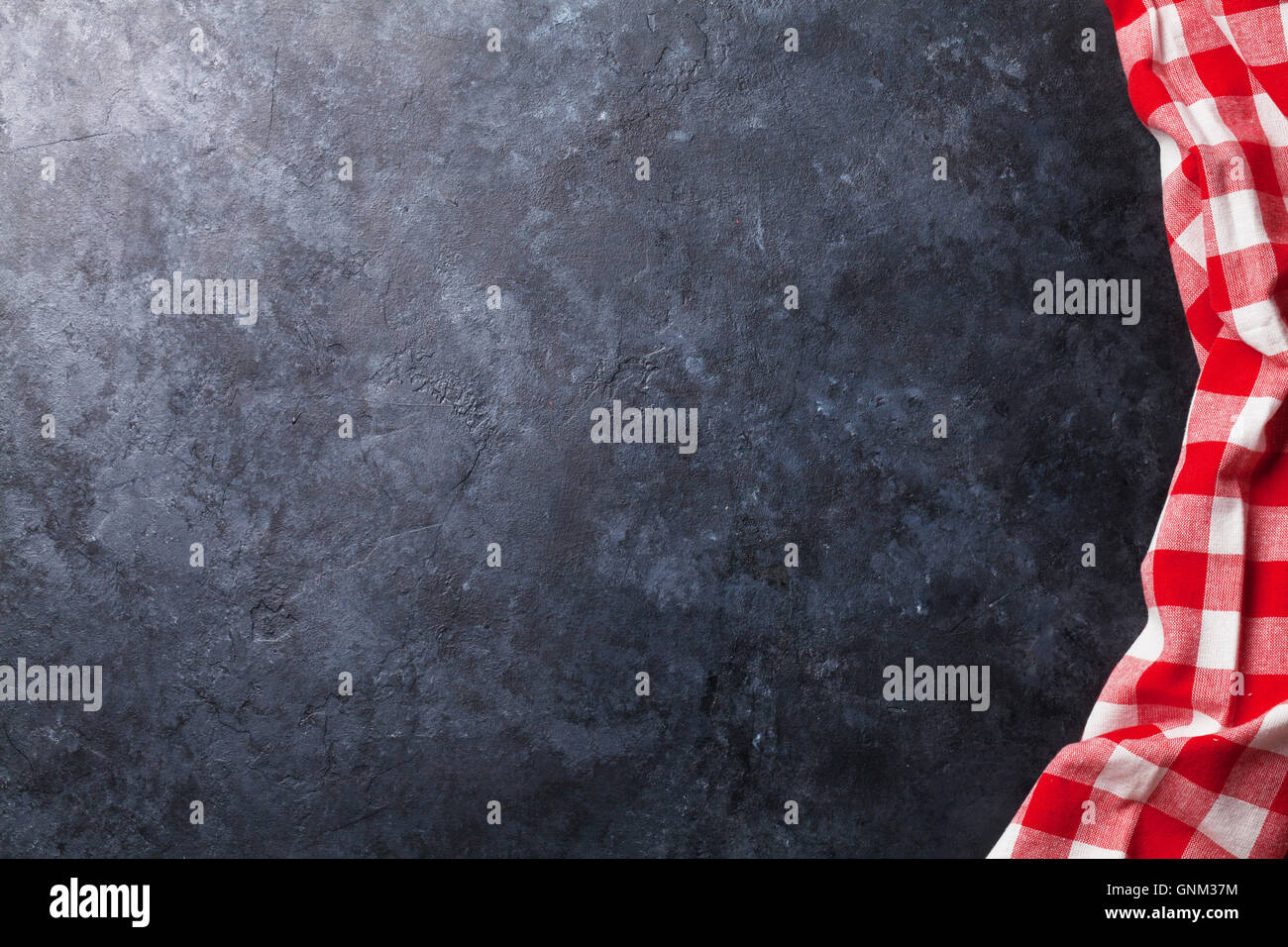 Towel over stone kitchen cooking table. Top view with copy space Stock ...