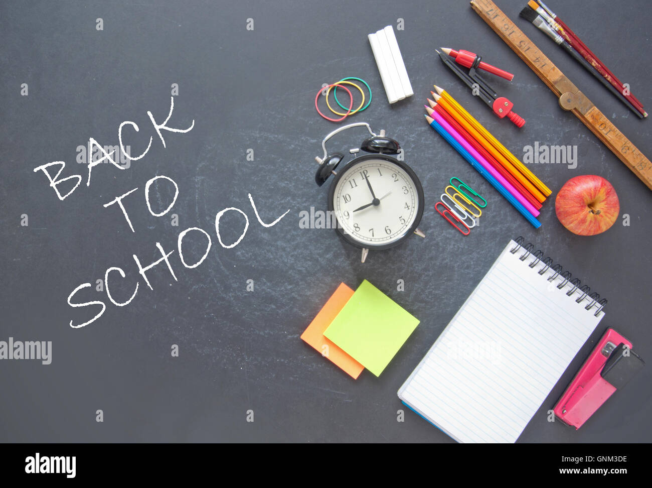 Back to school written on a chalkboad with stationery accessories Stock ...