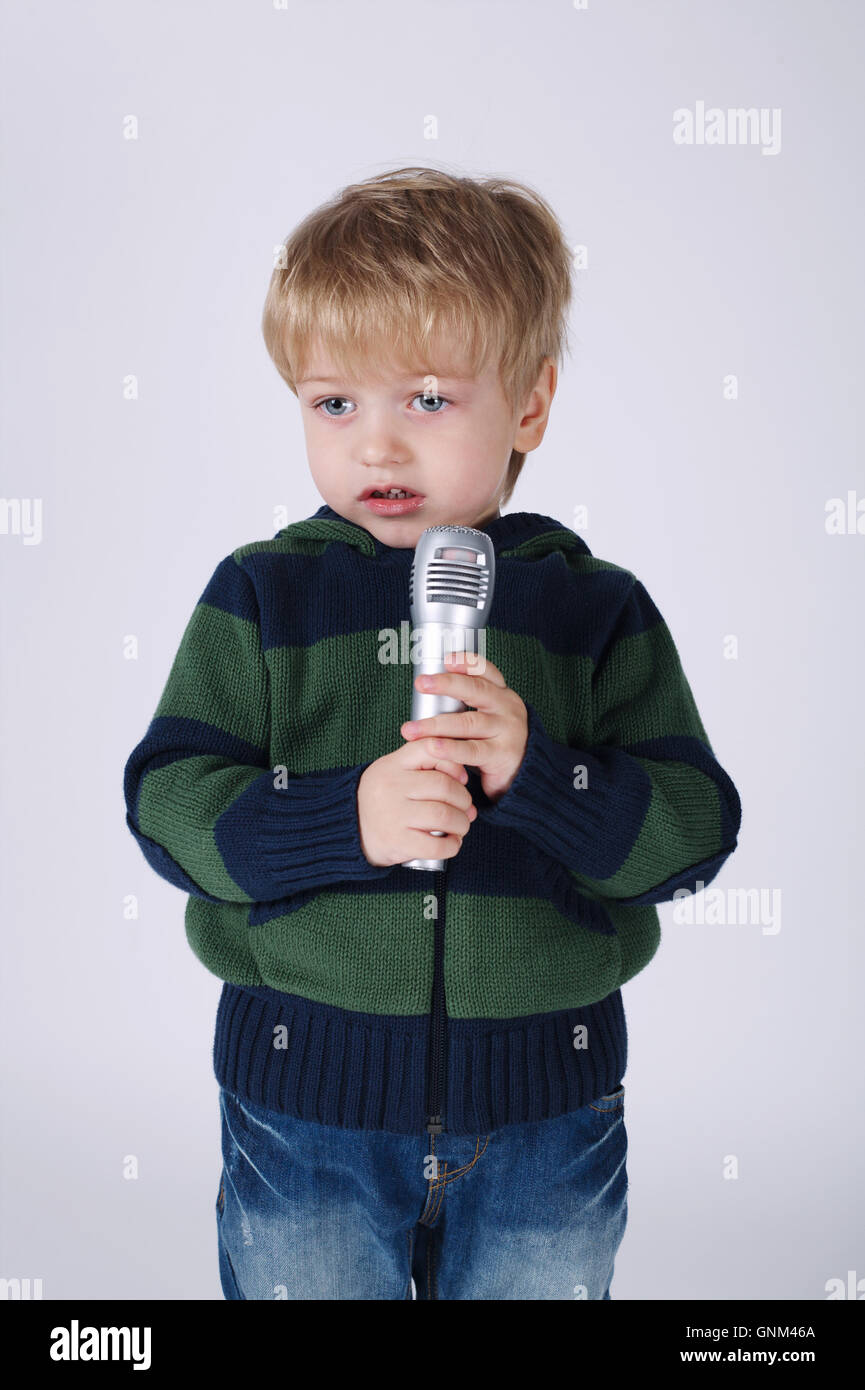 little singing boy with mic Stock Photo - Alamy
