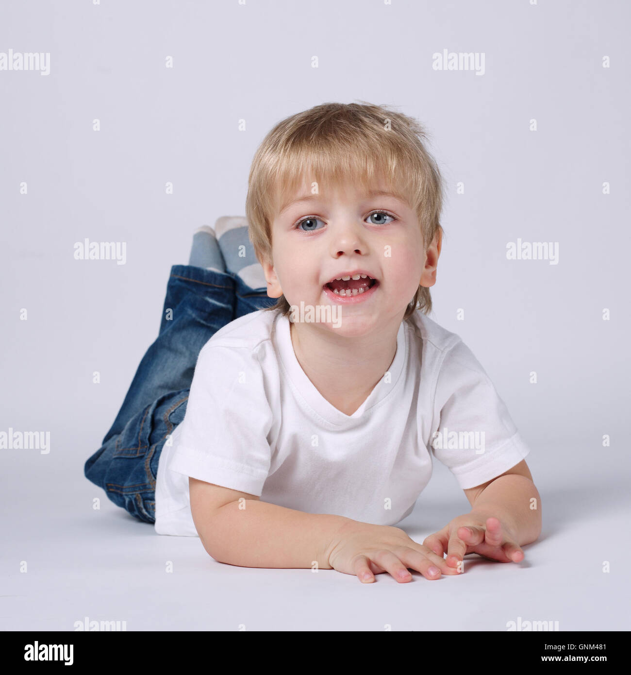 Isolated boy lying down hi-res stock photography and images - Alamy