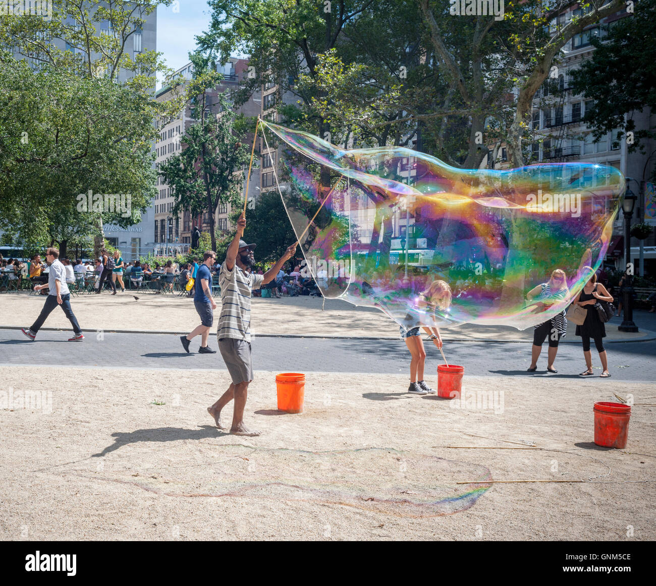 The "Bubble Man" in Madison Square Park in New York entertains visitors ...